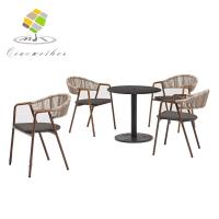 China Aluminum Tube Frame Garden Outdoor Stackable Arm Chair Weather Resistant Rattan Chair for Cafe Restaurant for sale