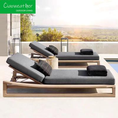 China Modern Teak Chaise Waterproof Cushioned Sun Lounger for Luxury Outdoor Pool and Beachside Relaxation for sale