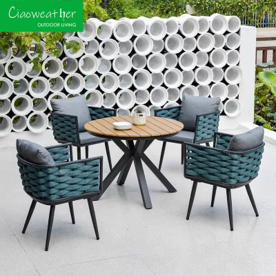 China Waterproof Outdoor Dining Set for Villa Garden Luxury Olefin Rope Rattan Weaving and Cushions for sale