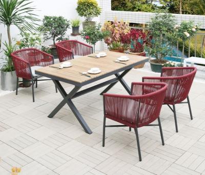 China Waterproof Polyester Fabric 4 Seat Rattan Dining Table And Chairs Set Sun Resistant for sale