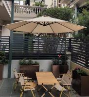China 2.7m Customized Logo Polyester Large Tilting Patio Umbrella Parasol for sale