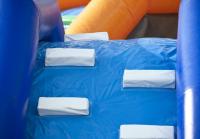 China Exciting Inflatable Amusement Park Adventurous Customizable Design With Centre Slide for sale