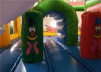 China Slide Huge Commercial Bounce House Smiling Face Image Lead Free Strong Struture for sale