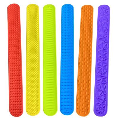 China Factory Wholesale Silicone Pressure-Relieving Toy, Children's Wristband Sensory Stone Silicone Slap Ring for sale