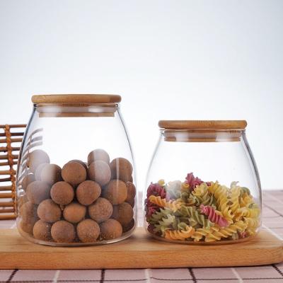 China Borosilicate Glass Storage Jar with Bamboo Lid 450ML 650ML 850ML Customizable Kitchen Canister for sale