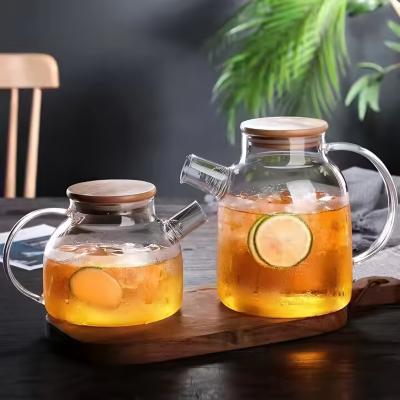 China 1L 1.8L High Borosilicate Glass Teapot with Handle Metal Lid Filter Large Capacity for sale