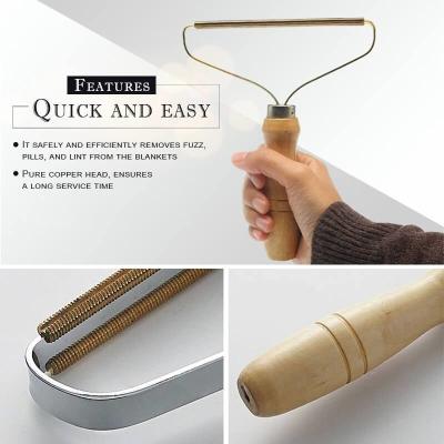China Portable Lint Remover Fabric Fuzz Remover 14cm Copper Head Battery-Free Clothes Brush for sale