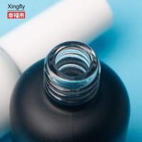 China Custom 11ml Round White Black UV Gel Empty Nail Polish Glass Bottle With Brush Caps for sale