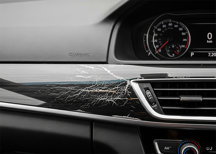 Over-polished car dashboard with uneven shine and oily appearance