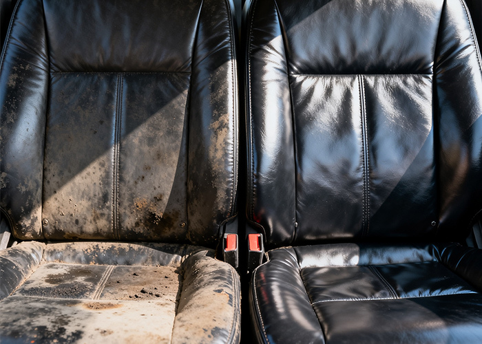 The comparison of the same leather seat before and after cleaning inside the car. The left side is a very dirty and dull seat, and the right side is a brand new leather seat after cleaning.