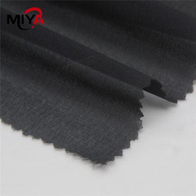 China Double Dot Woven Fusing Polyester Interlining White Black for sale