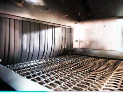 China Continuous Feed Tunnel Type Wire Mesh Shot Blasting Machine For Automotive Wheels for sale