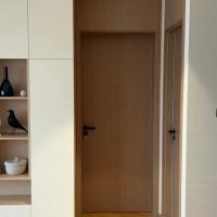 China Natural Wood Grain Customizable Water Resistant Solid Wood Interior Door Ecological Door for Villa Hotel Hospital for sale