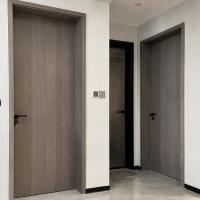 China Light Grey Slab Solid Wood Interior Door Minimalist Solid Wood Internal Door for Modern Apartments and Hotels for sale