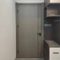 China Light Grey Slab Solid Wood Interior Door Minimalist Solid Wood Internal Door for Modern Apartments and Hotels for sale