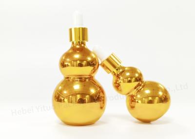China Leak Proof Recycling Essential Oil Dropper Bottles 50ml 100ml Glass with Gold Finish and Custom Logo Options for sale