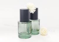 China Green Glass Perfume Bottles 50ml Bulk Cylinder Shape - 4.6cm Diameter 10.1cm Height with Custom Logo Options for sale