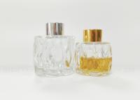 China Transparent Embossment Glass Reed Diffuser Bottles 30ml 50ml 100ml with 8.3cm Height Blow Molding for sale