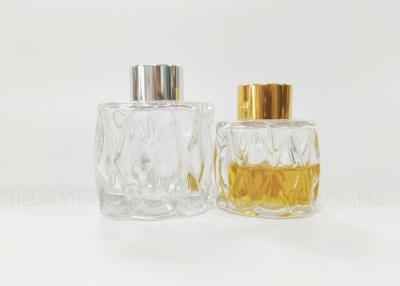 China Transparent Embossment Glass Reed Diffuser Bottles 30ml 50ml 100ml with 8.3cm Height Blow Molding for sale