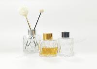 China Transparent Embossment Glass Reed Diffuser Bottles 30ml 50ml 100ml with 8.3cm Height Blow Molding for sale