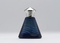 China Custom Blue Glass Perfume Bottle 30ml with 4.6cm Outer Diameter and Wave Relief Design for Luxury Fragrance Packaging for sale