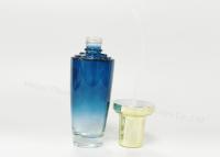 China Glass Reusable Lotion Bottles 60ml-150ml with Press Pump - Customizable Blue Spraying & Gold Cap Packaging for sale