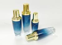 China Glass Reusable Lotion Bottles 60ml-150ml with Press Pump - Customizable Blue Spraying & Gold Cap Packaging for sale