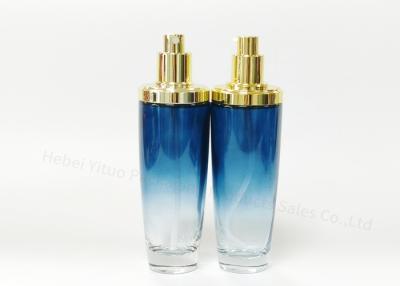 China Glass Reusable Lotion Bottles 60ml-150ml with Press Pump - Customizable Blue Spraying & Gold Cap Packaging for sale