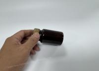 China 20ml Food-Grade Plastic Medicine Bottle with Dark Brown Body and Gold Cap - 2.4cm Width for sale