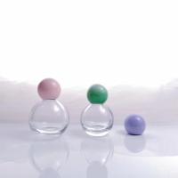 China Refillable Bulk Perfume Bottles 30ml 50ml Transparent Glass with Lid Sealing and Custom Logo Options for sale