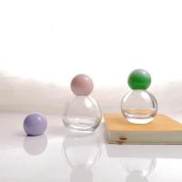 China Refillable Bulk Perfume Bottles 30ml 50ml Transparent Glass with Lid Sealing and Custom Logo Options for sale