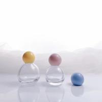 China Refillable Bulk Perfume Bottles 30ml 50ml Transparent Glass with Lid Sealing and Custom Logo Options for sale