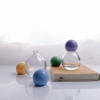 China Refillable Bulk Perfume Bottles 30ml 50ml Transparent Glass with Lid Sealing and Custom Logo Options for sale