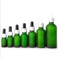 China Refillable Frosted Green Glass Dropper Bottles 10ml to 100ml with UV Protection and Custom Logo Options for sale