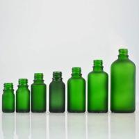 China Refillable Frosted Green Glass Dropper Bottles 10ml to 100ml with UV Protection and Custom Logo Options for sale