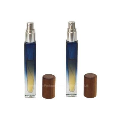 China 10ml Blue Glass Cosmetic Spray Bottle with Wooden Cap - Premium Travel Size Packaging for sale