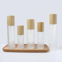 China Custom Logo Attar Atomizer Spray Bottle 60ml 100ml Plastic with Wooden Cap for Cosmetics and Personal Care for sale