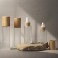 China Custom Logo Attar Atomizer Spray Bottle 60ml 100ml Plastic with Wooden Cap for Cosmetics and Personal Care for sale