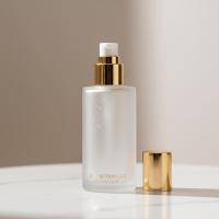 China Empty Lotion Bottle Luxury 1oz Glass Frosted with Gold Pump 60ml 100ml for sale