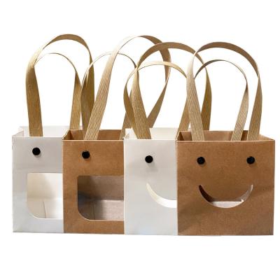China manufacturers white cardboard clothing custom packs packaging gift shopping package kraft Rivet paper bags with your own logo for sale