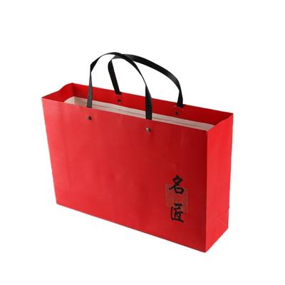 China Packaging White Printed Kraft Paper Bags ，Paper Shopping Bags With Logo for sale