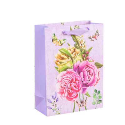 China manufactures custom Logo print luxury wedding dress shopping gift packaging paper bag for sale