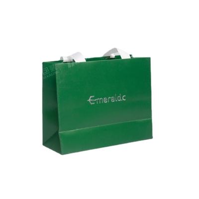 China Cardboard Black Paper Bag Custom Front and Back Printed Logo Shopping Paper Bags Luxury Clothing Packaging Gift Carrier Bag for sale