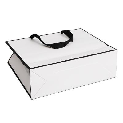 China Wholesale Luxury Matte Glossy Black Gift Shopping Paper Bag With Logo For Clothing Toy Custom Packaging Bag for sale