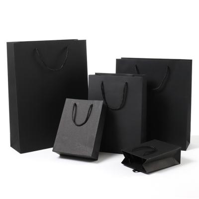 China Custom Luxury Black White Brown Kraft Gift Shopping Paper Bags With Your Own Logo for sale