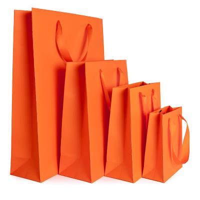 China Wholesale Luxury Packing Paper Bag Printed Custom Logo Clothing Shopping Gift Jewelry Packaging Paper Bag for sale