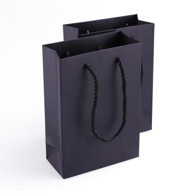 China Custom Printed Your Own Logo Cardboard Packaging Black Gift Craft Shopping Paper Bag With Handles for sale