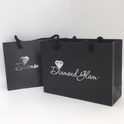 China Manufacturers Custom paper bags Factory Directly Supply boutique shopping bags packaging bag with ribbon logo die cut for sale