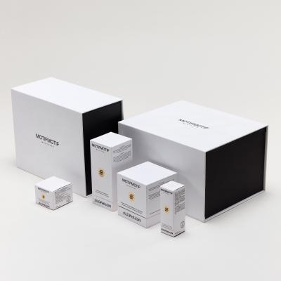 China Foldable Cosmetic Packaging Box Rigid Gift Packaging Box With Ribbon Closure for sale