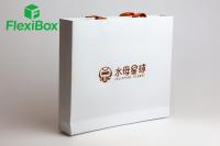 China Branded White Specialty Paper Tote Bag with Orange Flat-Cord Handles and Custom Graphic for sale